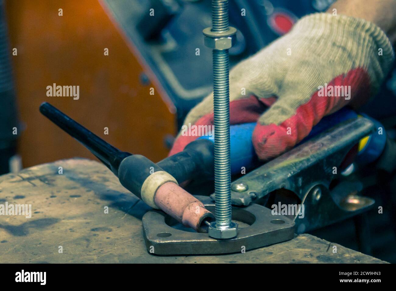 Welding the stainless steel stud to the flange Stock Photo - Alamy