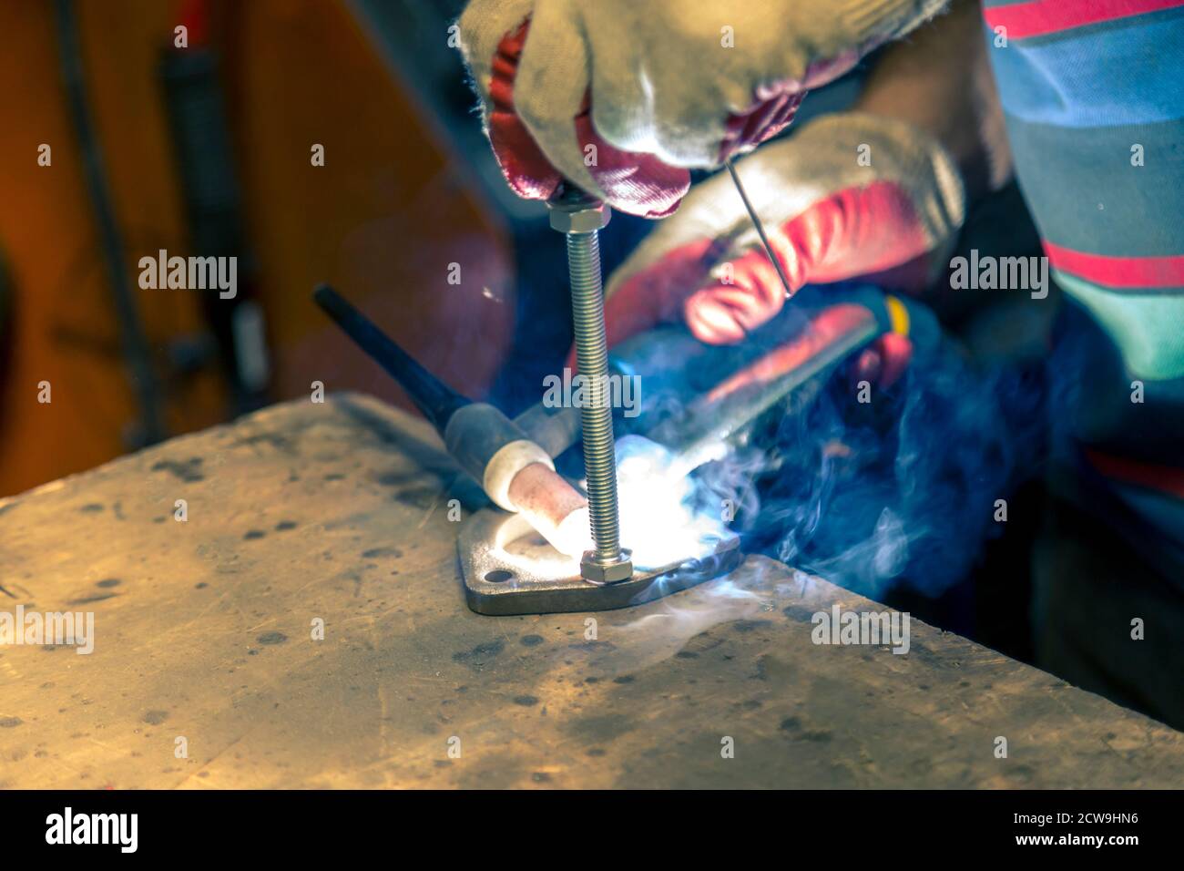 Welding the stainless steel stud to the flange Stock Photo - Alamy