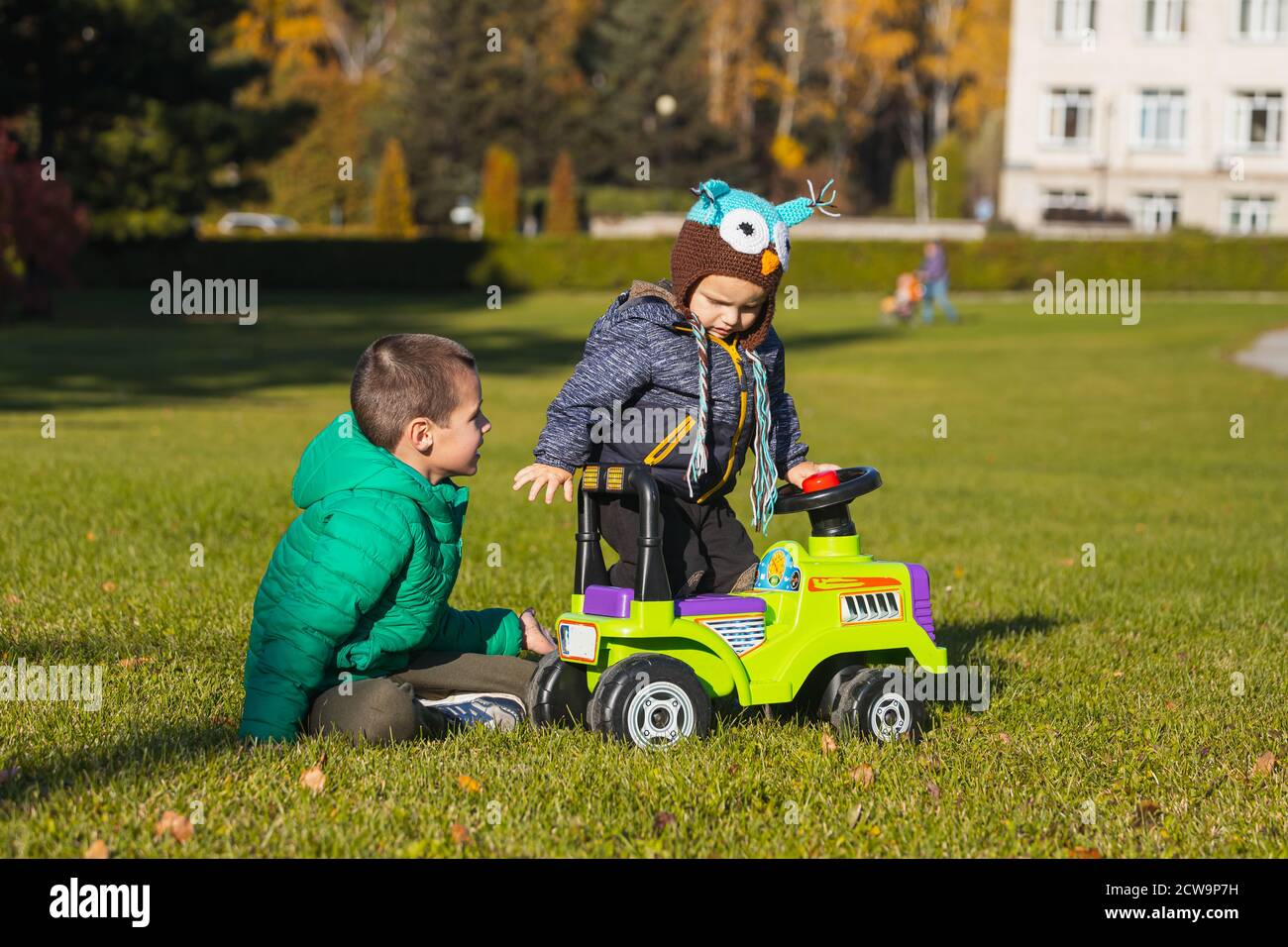 Two cheerful brothers-boys of different ages have fun playing with a ...