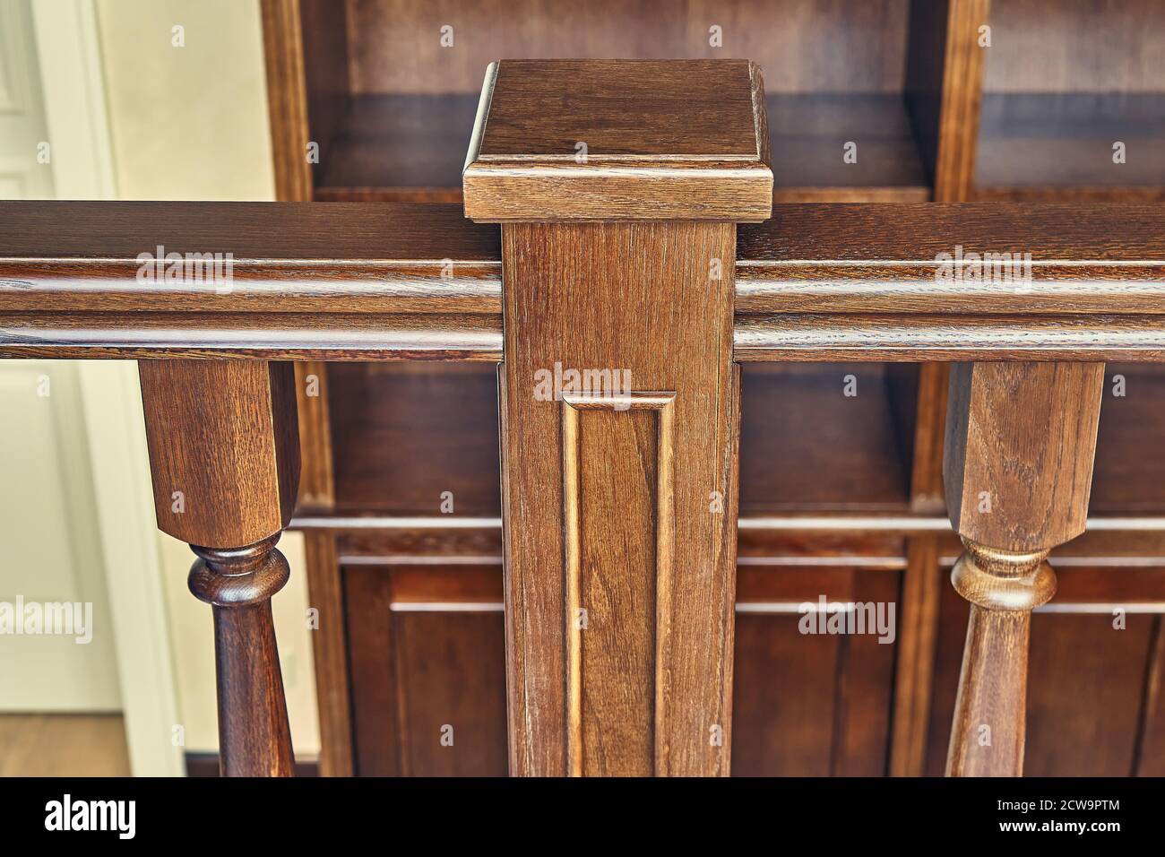 Perspective view of detail of ornate wooden railing in contemporary ...
