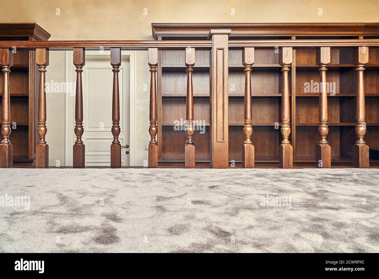 Home library. Wooden bookcase with empty shelves and a wooden ...