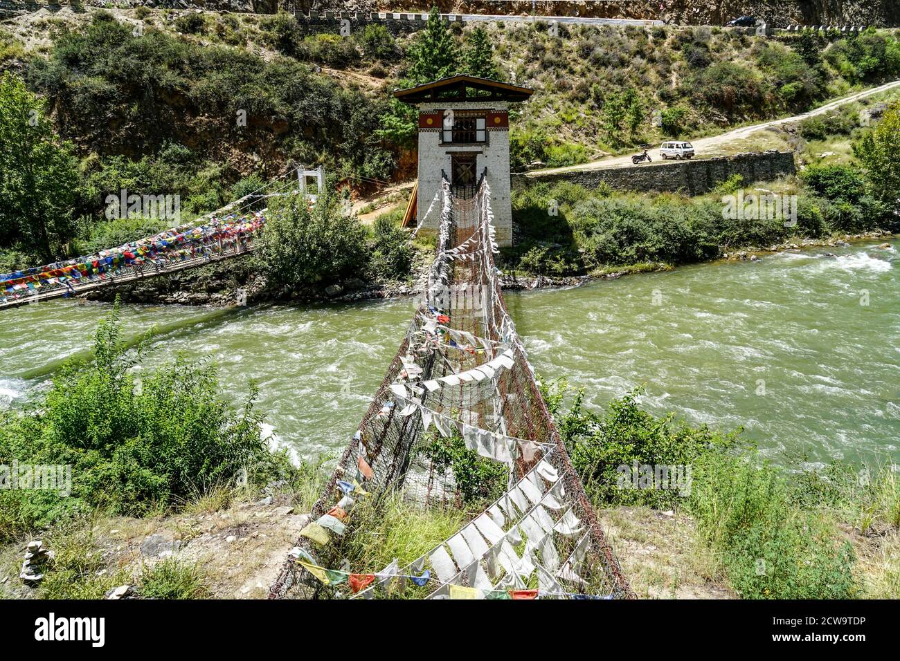 Iron chain suspension bridge next to Tachogang Lhakhang in Paro, Bhutan ...