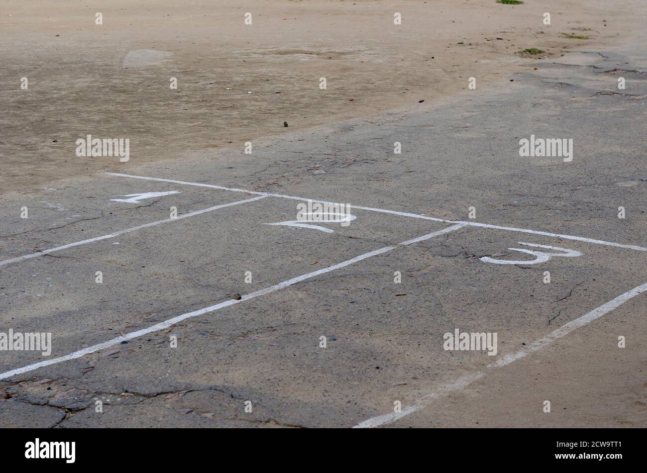 White lines and numbers 1, 2, 3 on the asphalt. Number of treadmills on ...