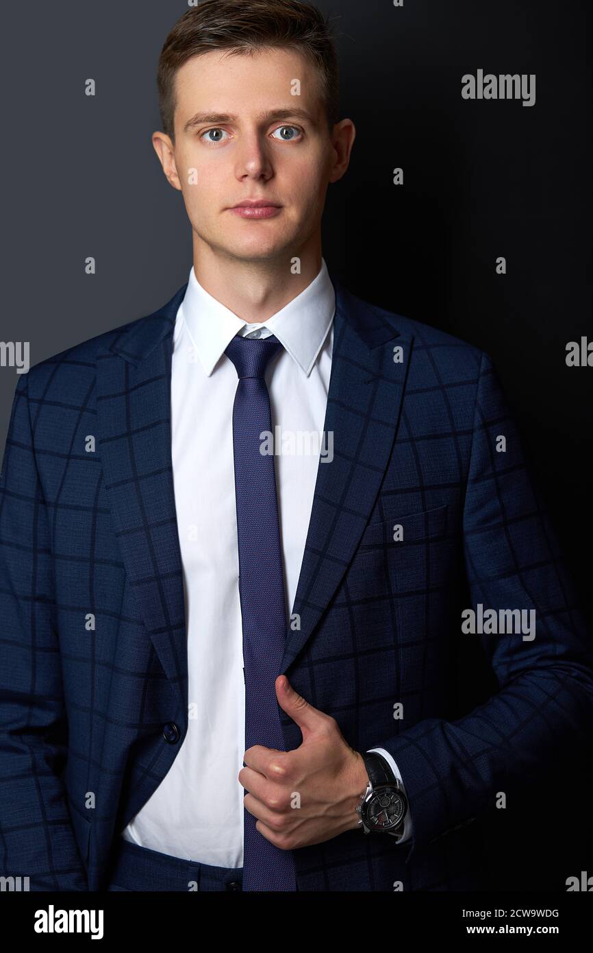 confident trendy caucasian guy in formal stylish suit posing isolated ...
