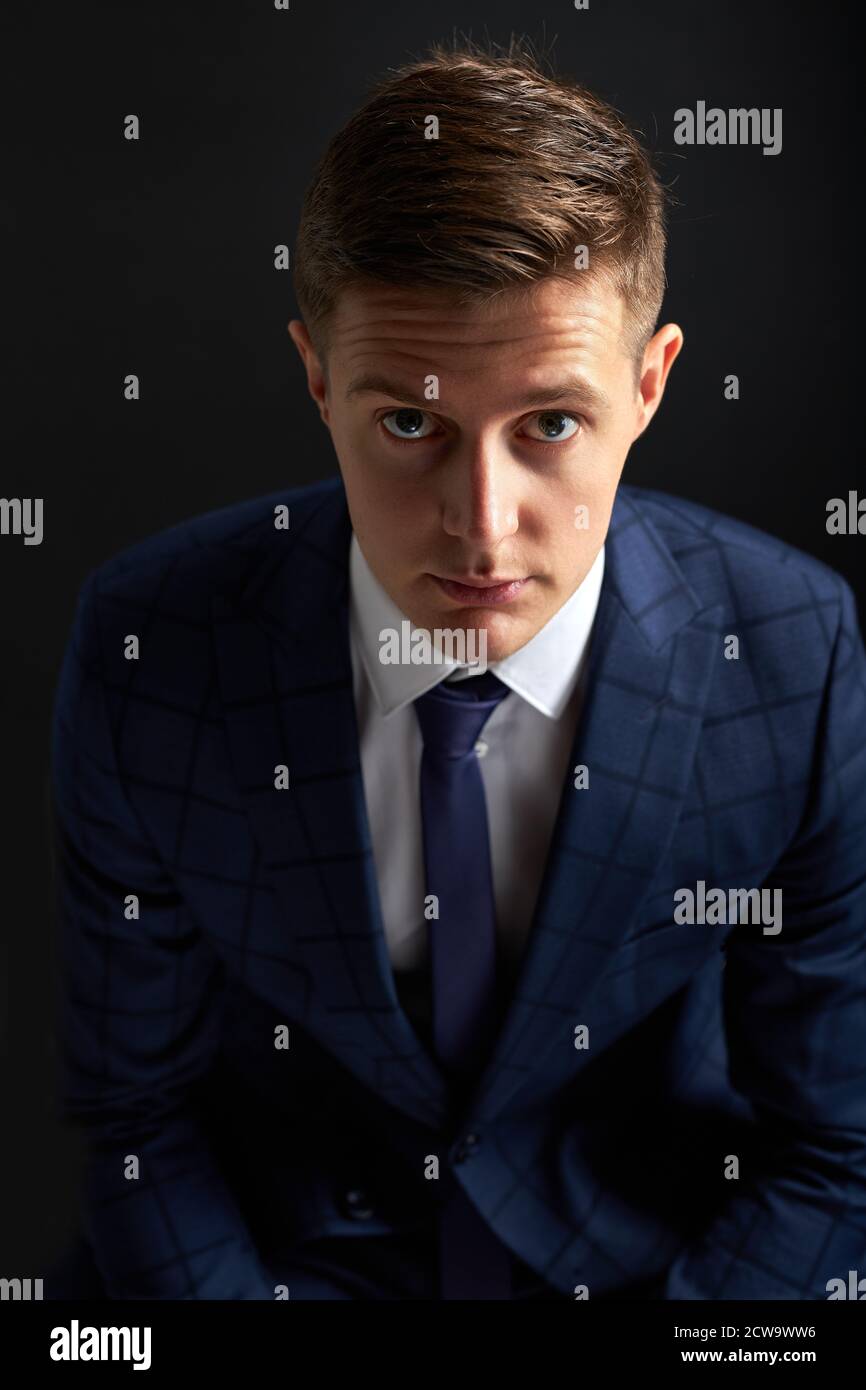 innocent male in classic suit look at camera, young businessman ...