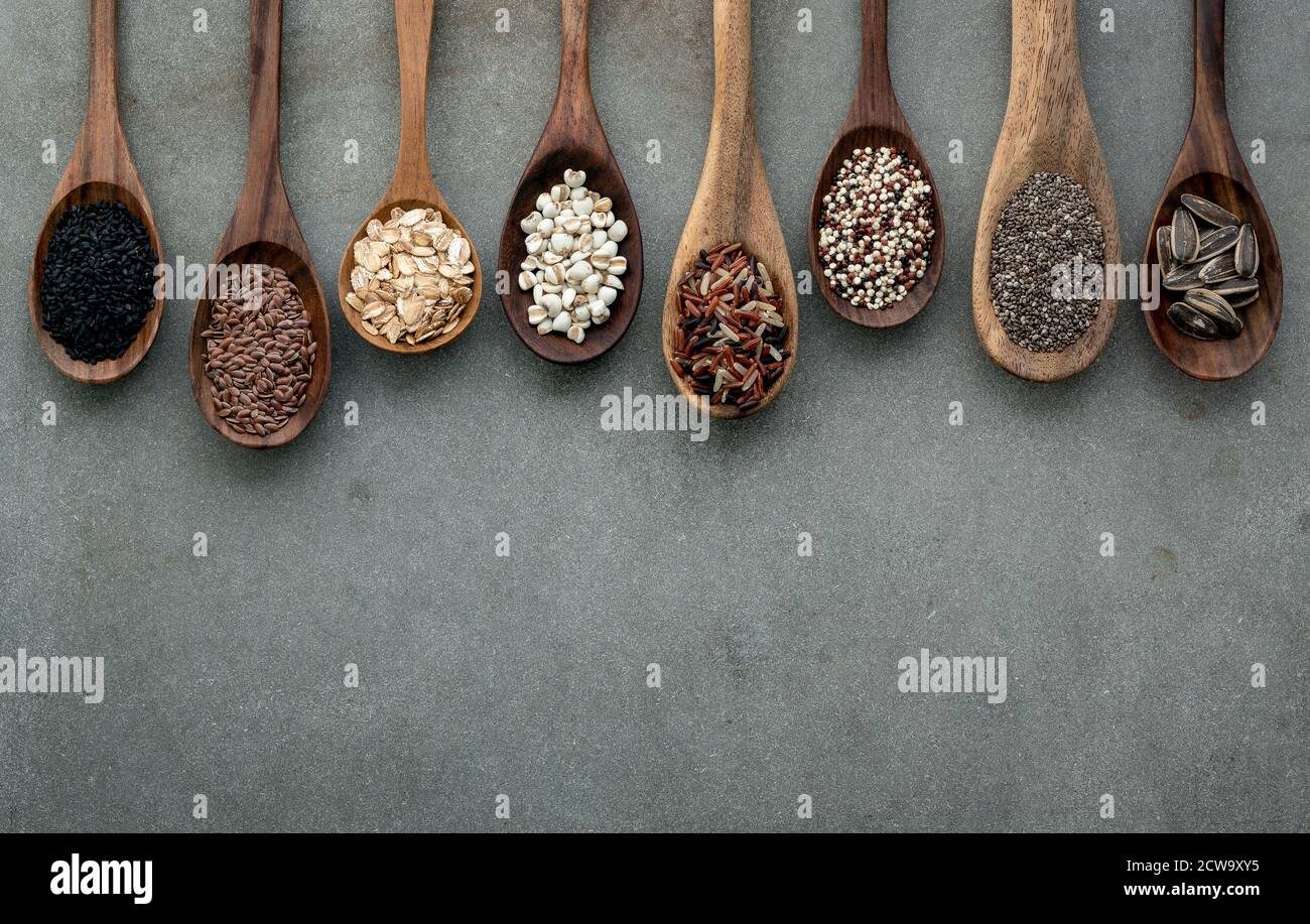 Different types of grains and cereals on shabby concrete background ...