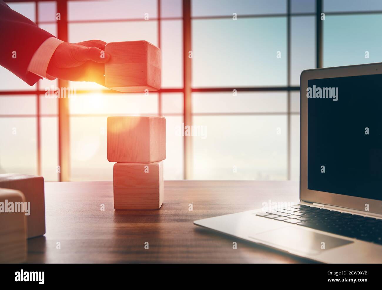 The concept of planning in business. Wooden cubes on a desk in the ...
