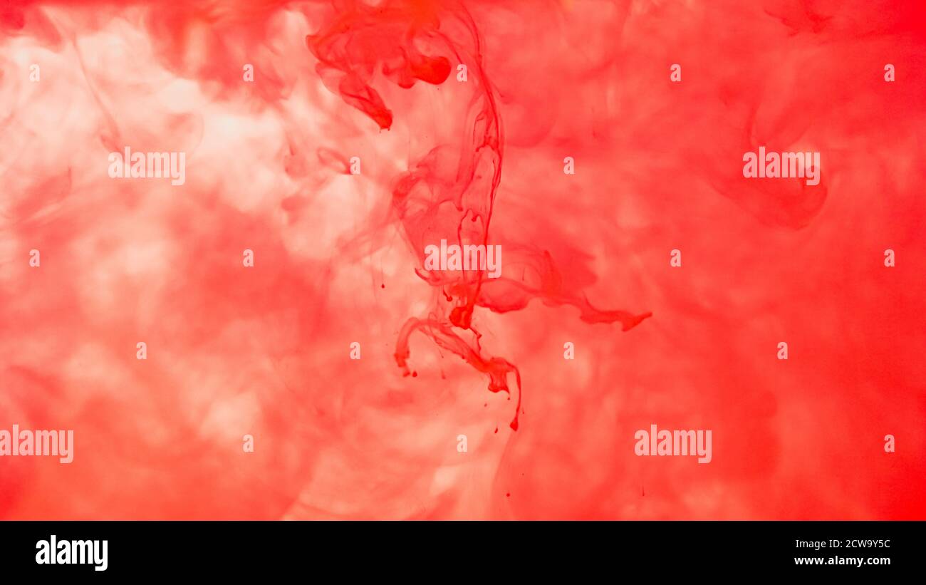 Red ink drop in water on white background. Watercolor paint splash ...