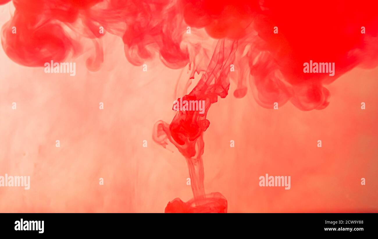 Red ink drop in water on white background. Watercolor paint splash ...