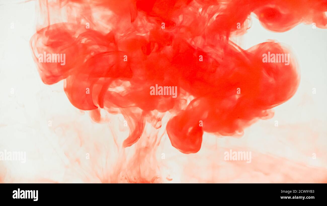 Red ink drop in water on white background. Watercolor paint splash ...