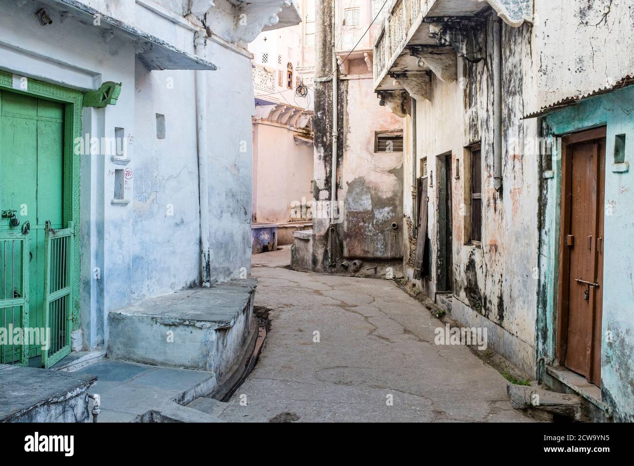Narrow colourful backstreets of the village of Delwara in rural ...