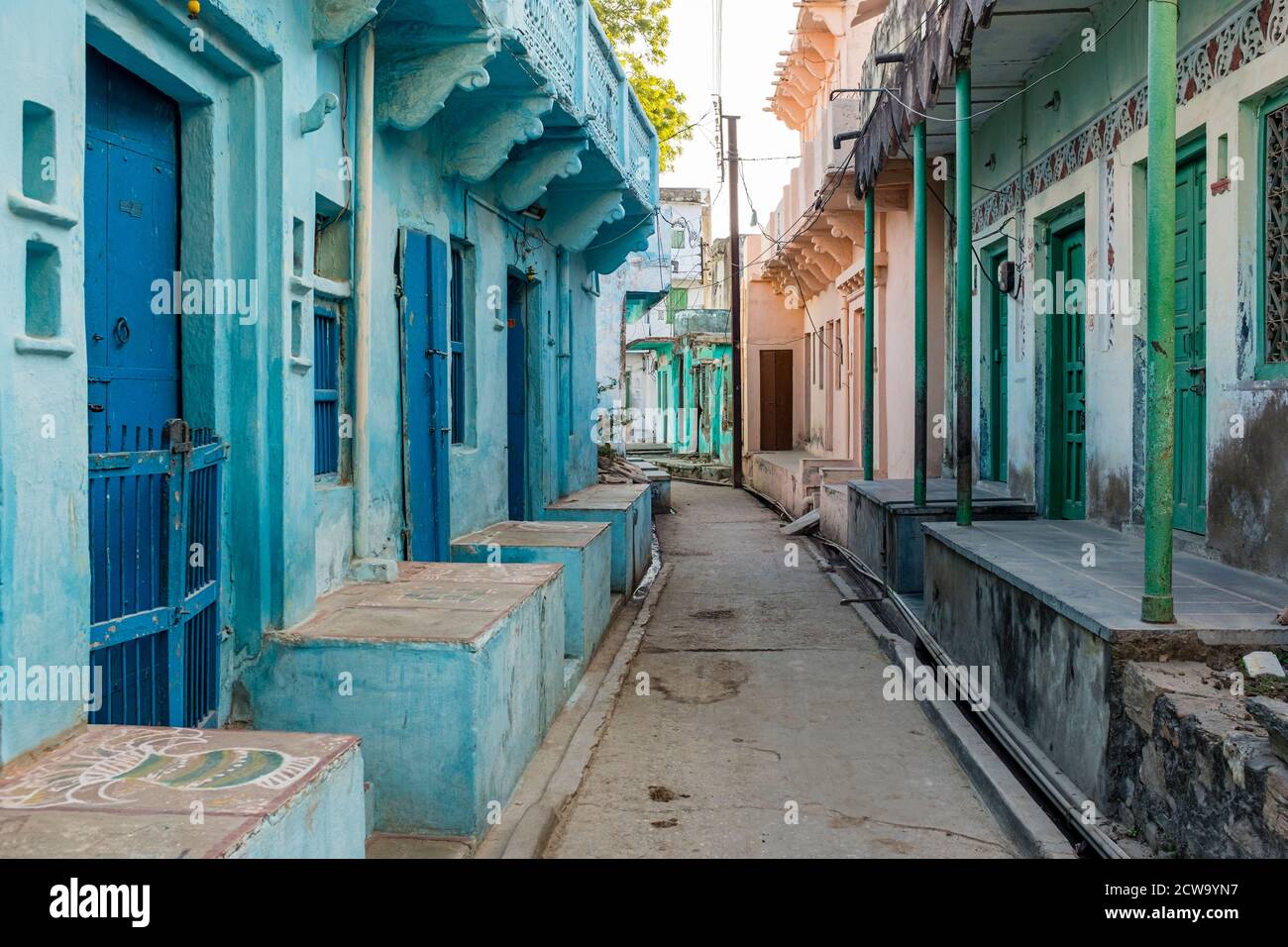 Narrow colourful backstreets of the village of Delwara in rural ...