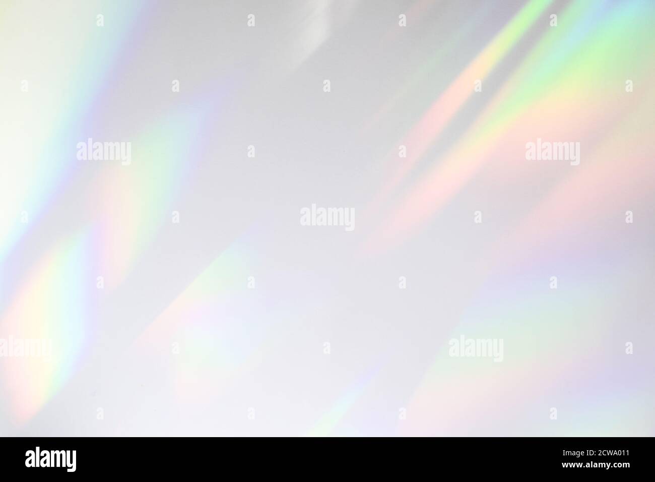 Blurred rainbow light refraction texture on white wall Stock Photo - Alamy