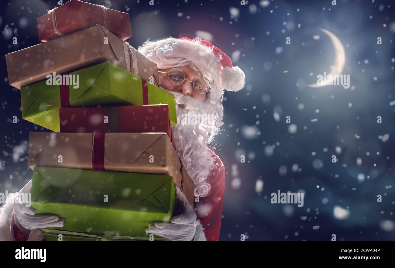 Merry Christmas and happy holidays! Santa Claus brings lots of presents ...