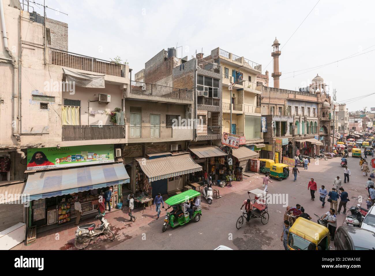 Crowded shops and traffic on Main Bazar in New Delhi, India Stock Photo ...