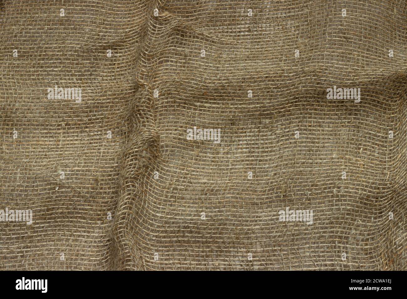 The structure of the threads of a natural burlap fabric close up Stock ...
