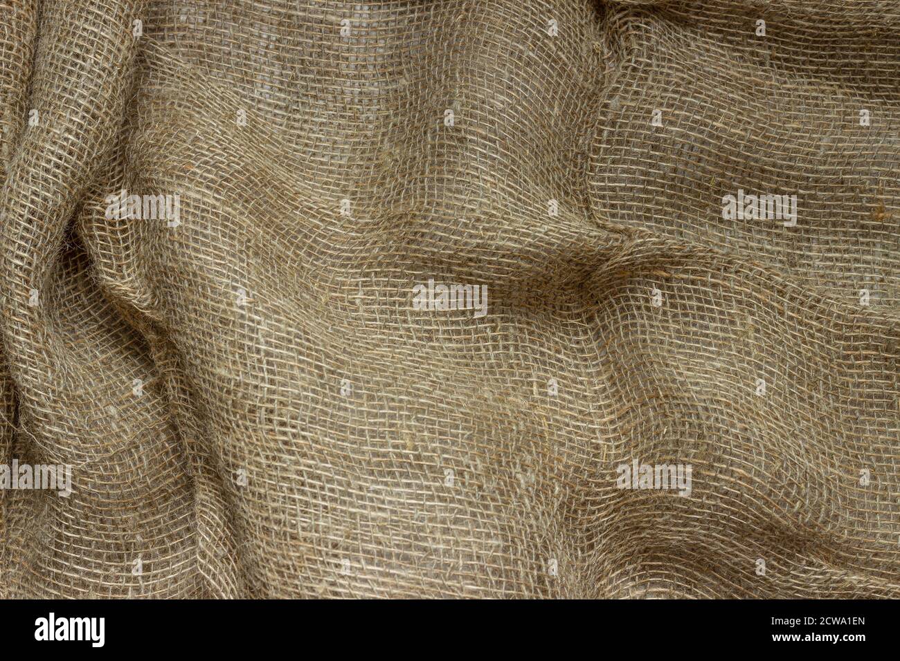 The structure of the threads of a natural burlap fabric close up Stock ...