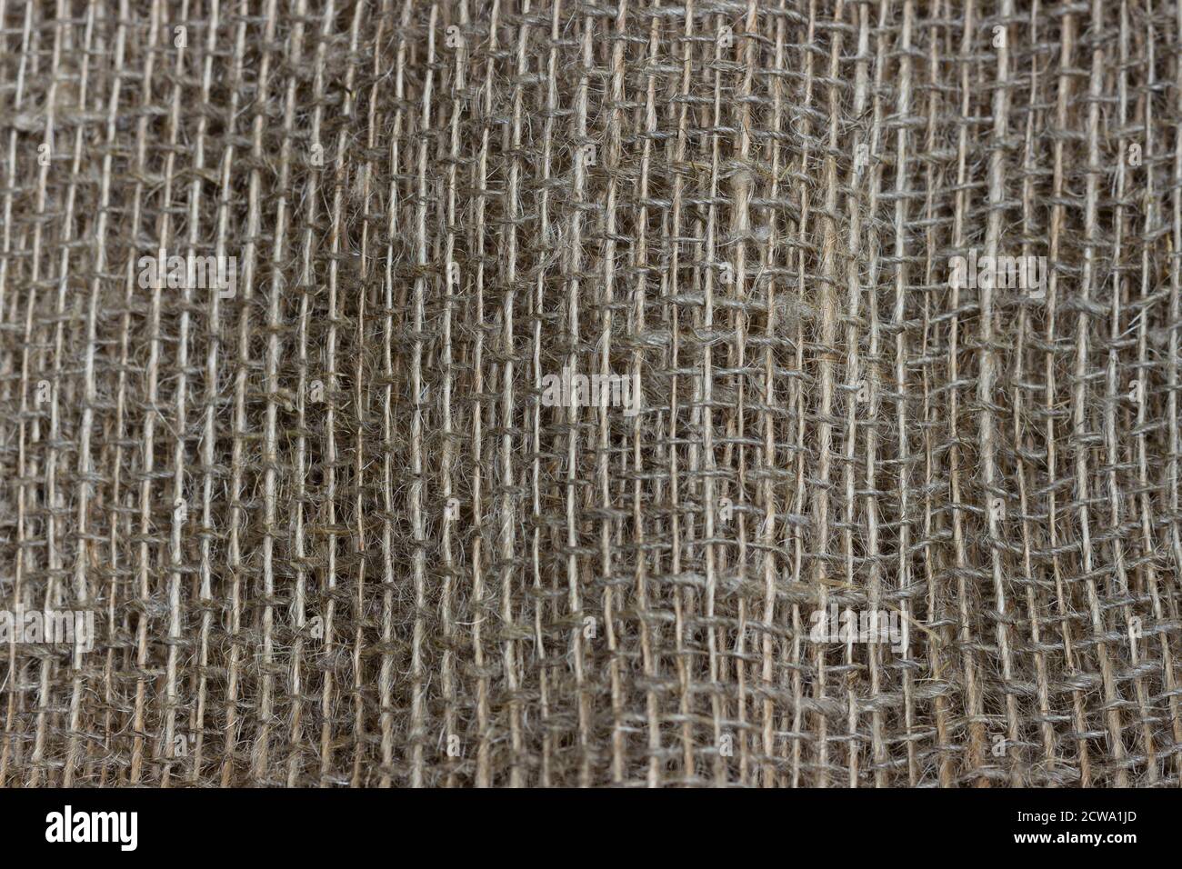 The structure of the threads of a natural burlap fabric close up Stock ...