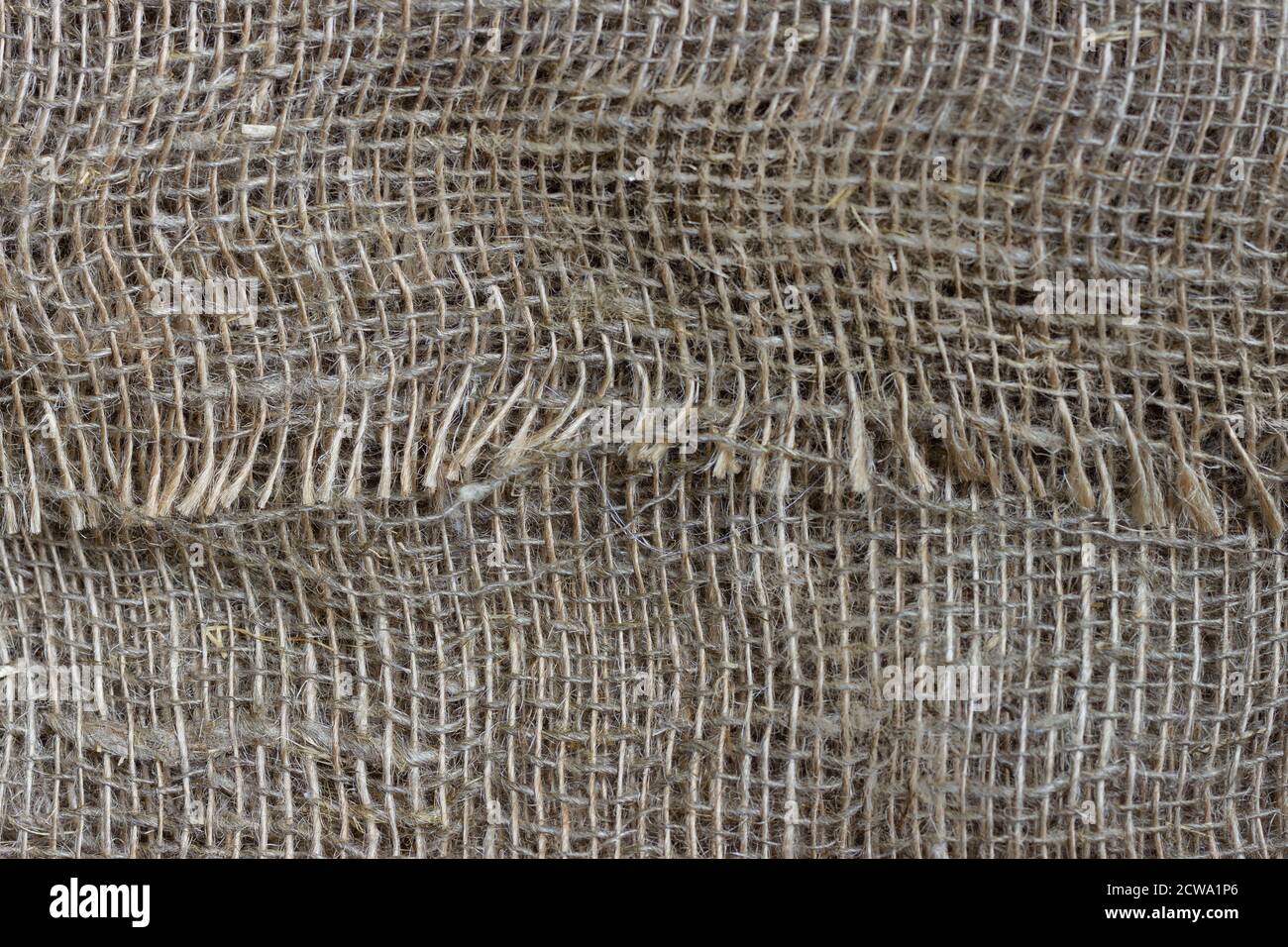 The structure of the threads of a natural burlap fabric close up Stock ...
