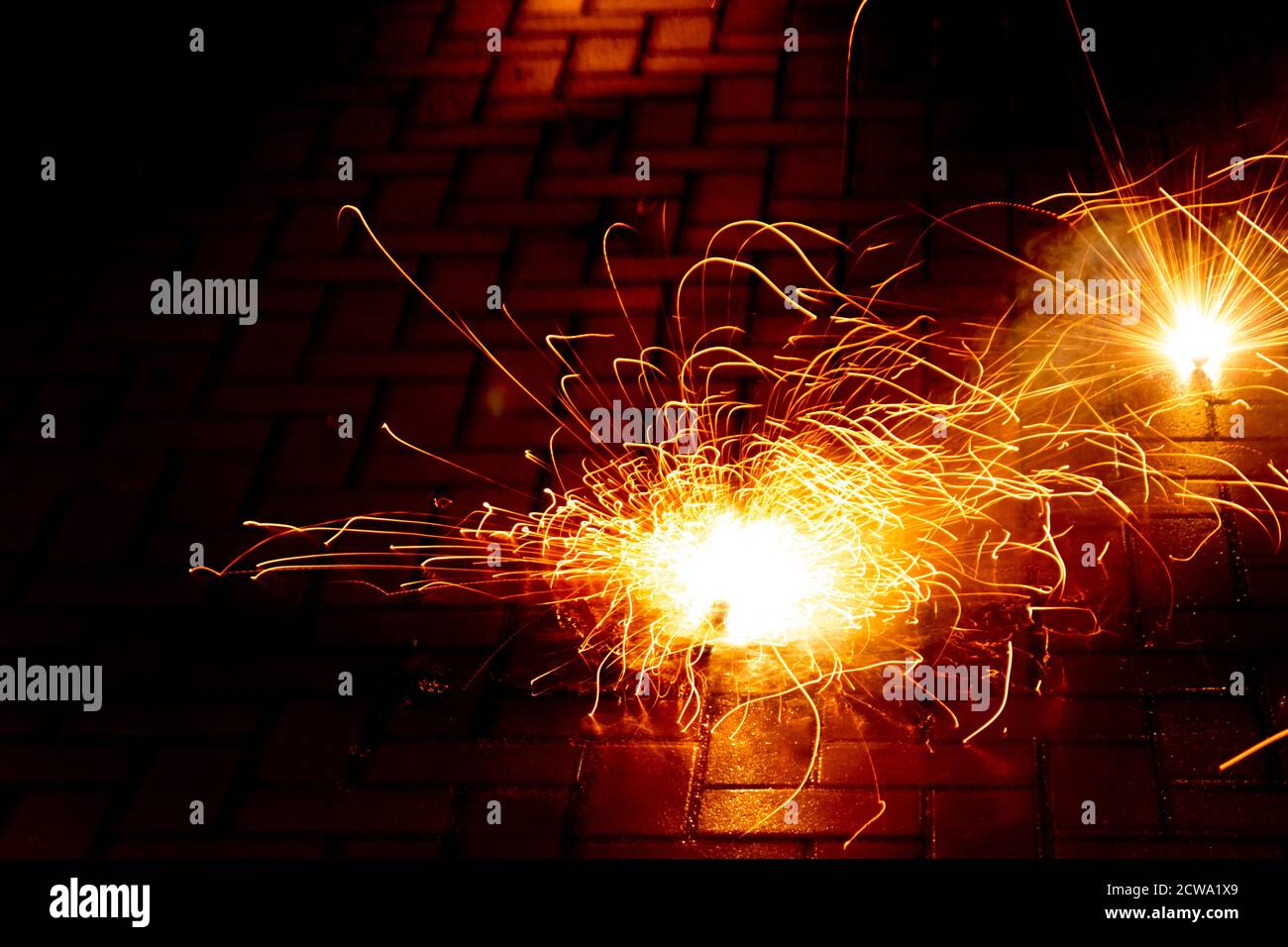 Gorgeous firework with firecrackers and fountains of light illuminates ...