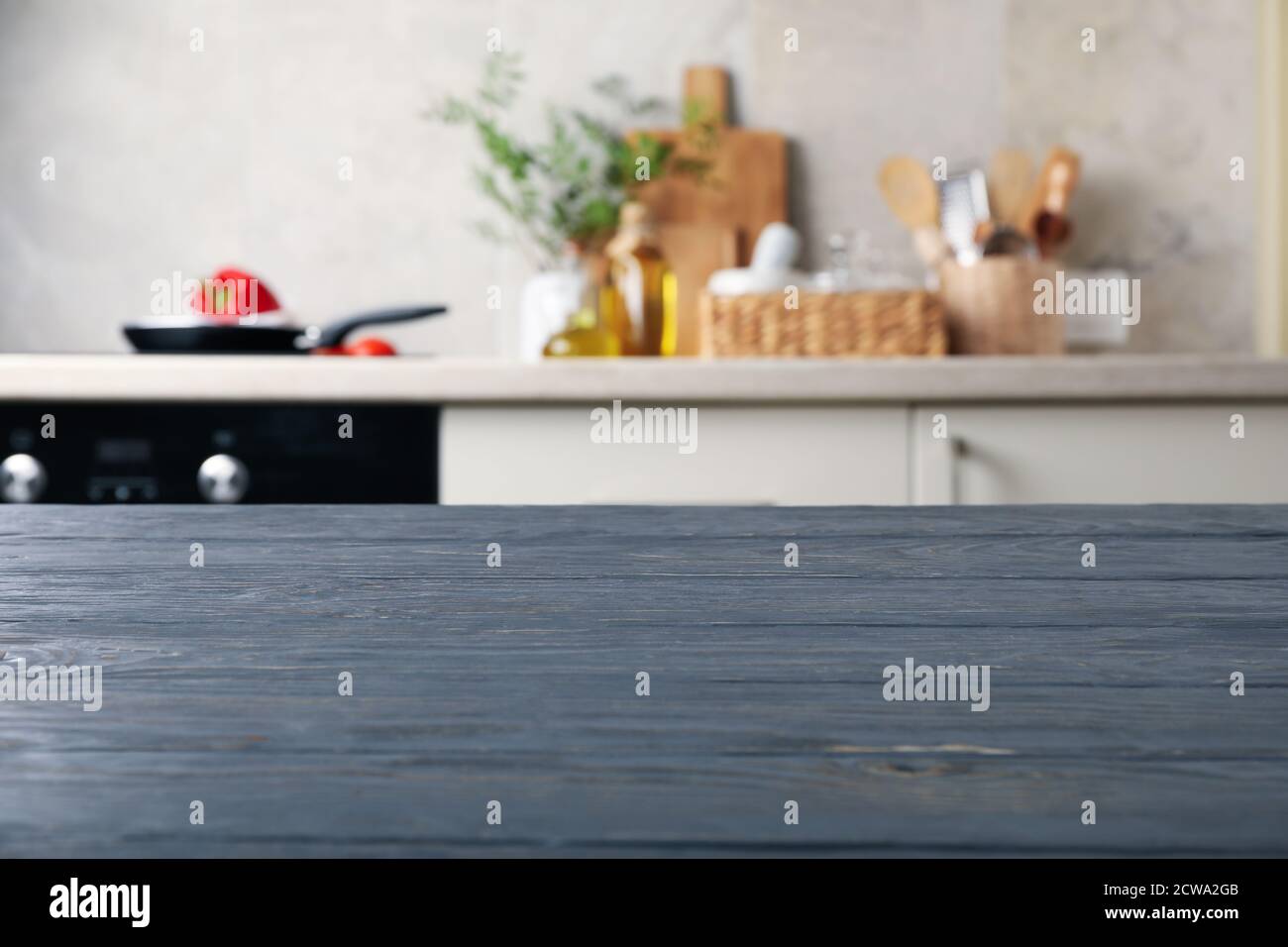 Wood table on blur kitchen room background Stock Photo - Alamy