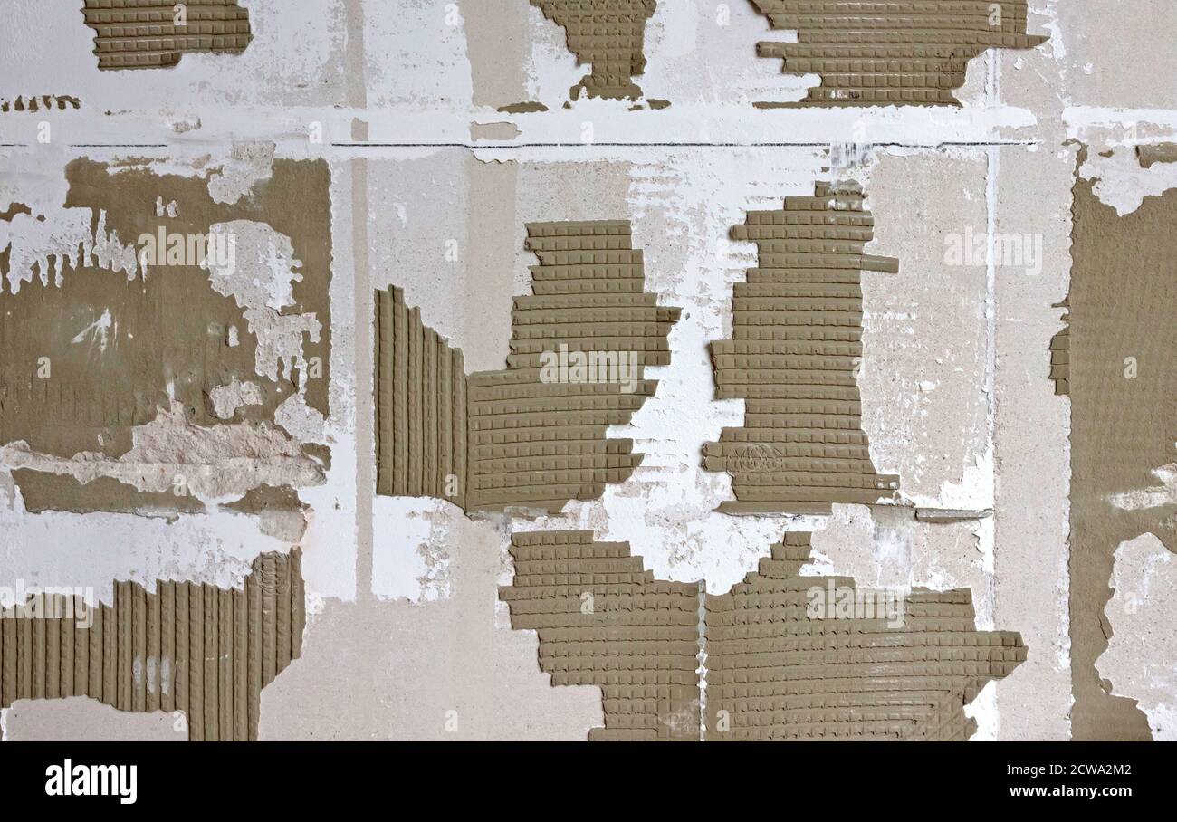 Breaking ceramic tiles, work in progress, maintenance Stock Photo - Alamy