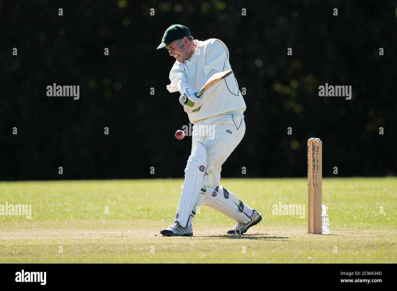 Cricket batsman playing shot Stock Photo - Alamy