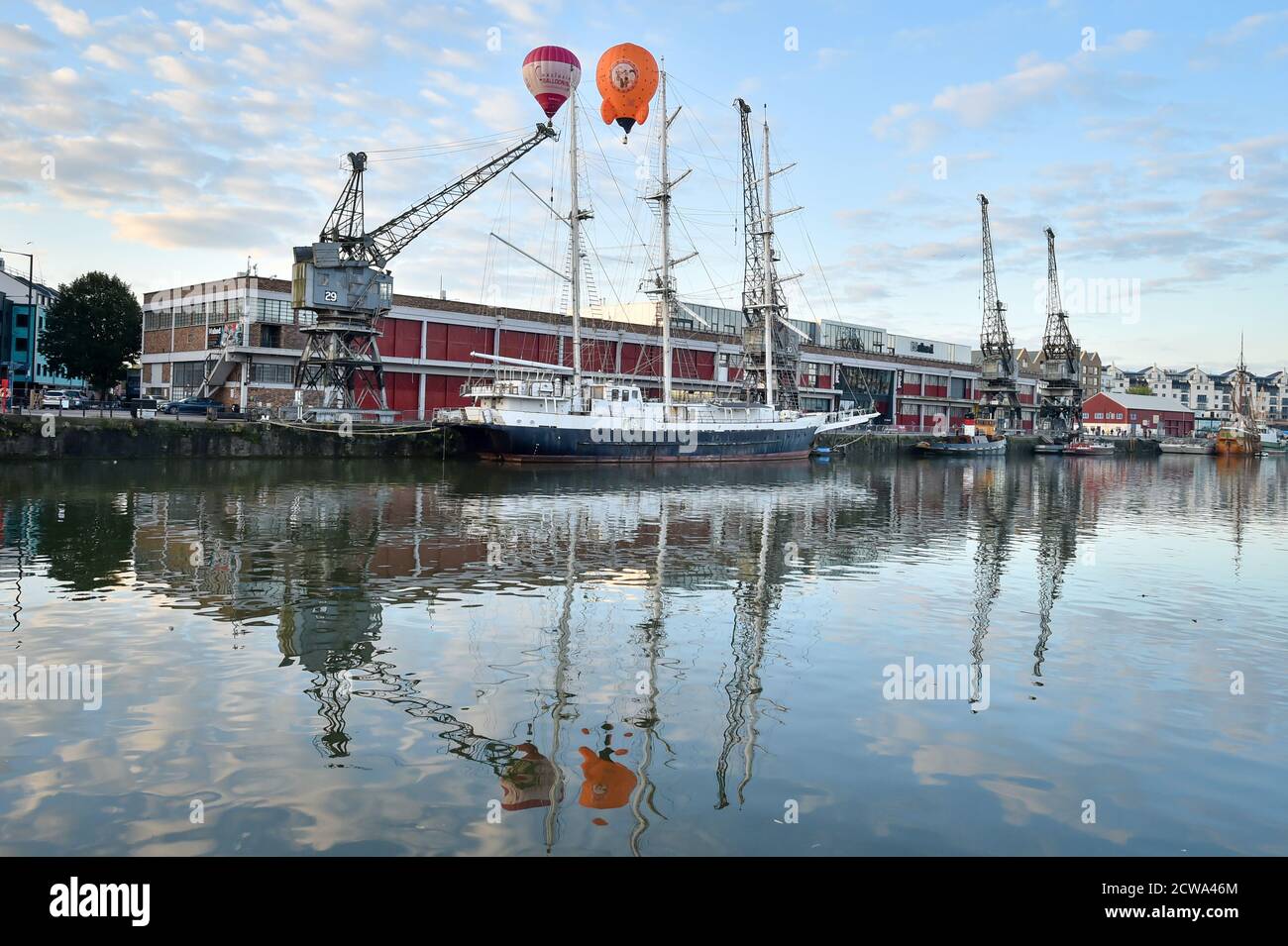 Balloons pass over ships on Bristol harbourside during the maiden ...