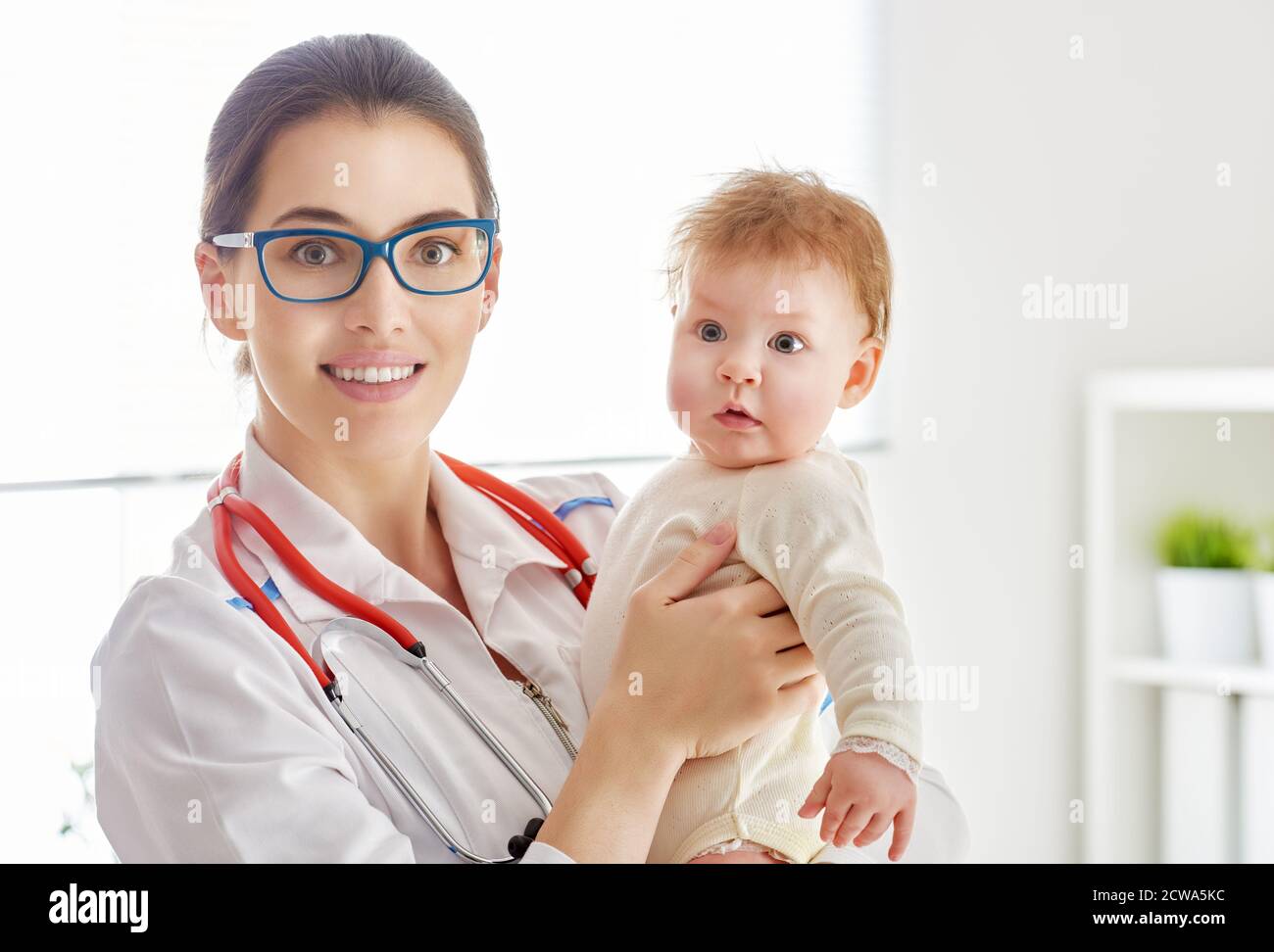 doctor examining a baby in a hospital Stock Photo - Alamy