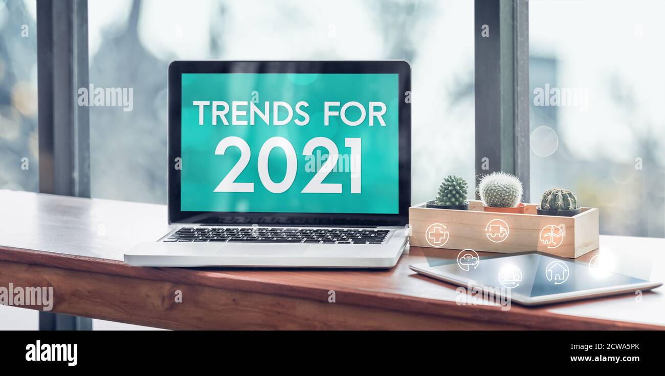 Trends for 2021 in laptop computer screen with icon floating on tablet ...