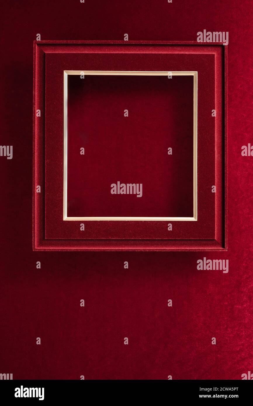 Blank Red Christmas felt photo frame on velvet red felt fabric top view ...