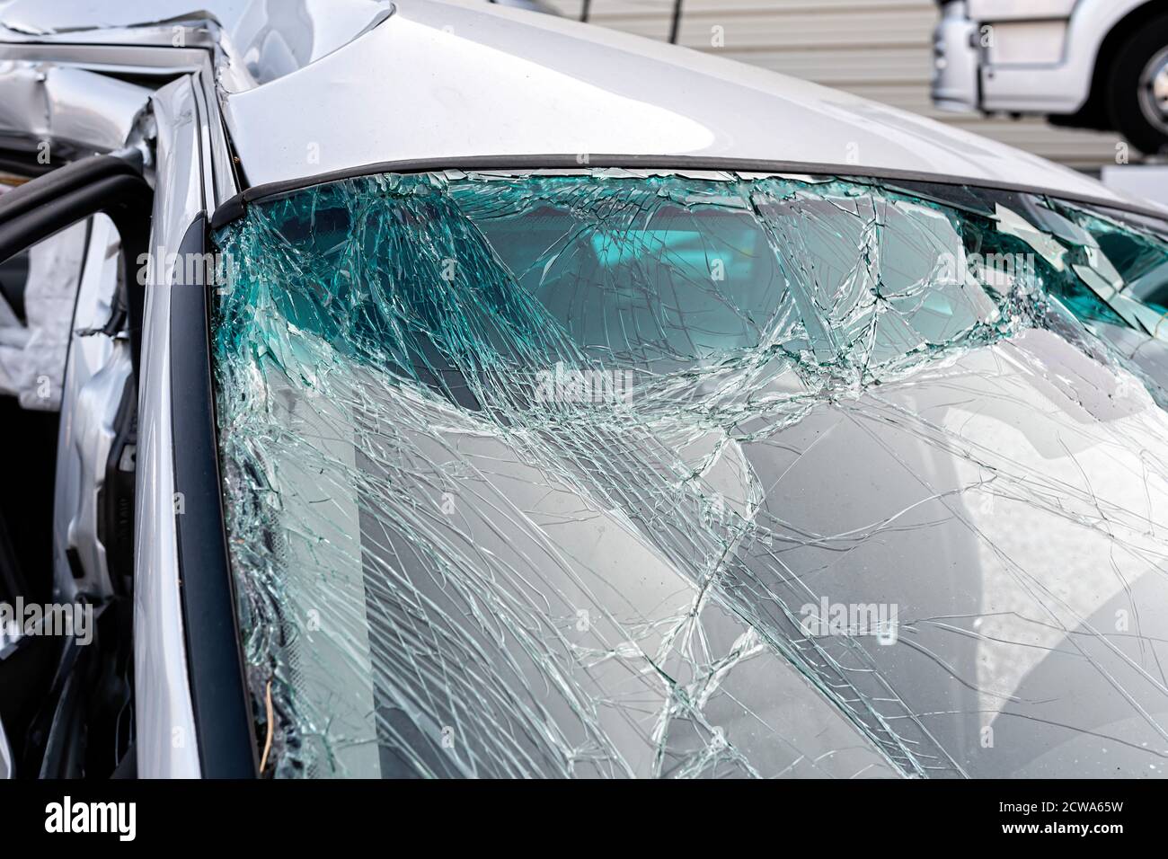 damaged vehicle closeup after a heavy crash, car wreck, broken ...