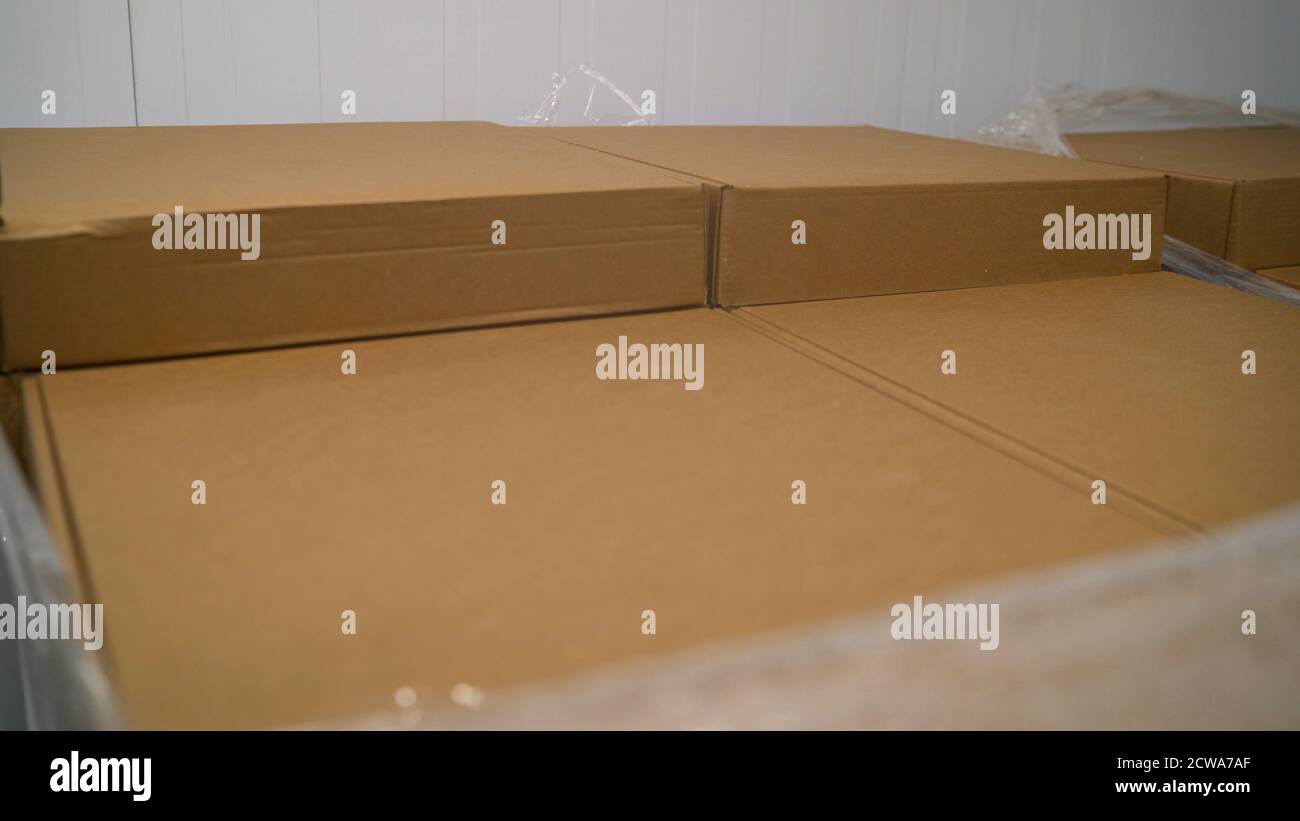Flat cardboard boxes in stock. A pile of shipping boxes Stock Photo - Alamy