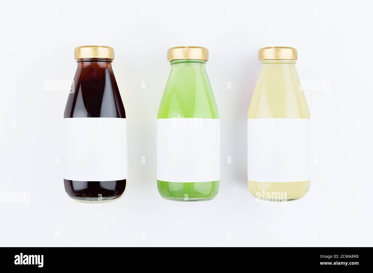 Collection of fresh fruits juices - yellow, green, violet in glass ...