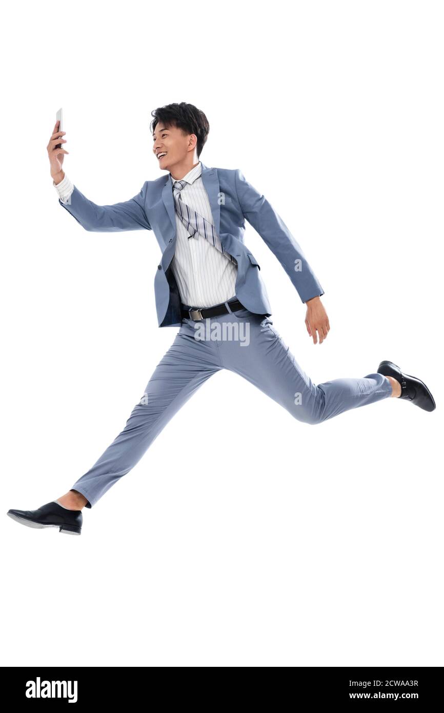 Pick up the phone run jump a business man Stock Photo - Alamy