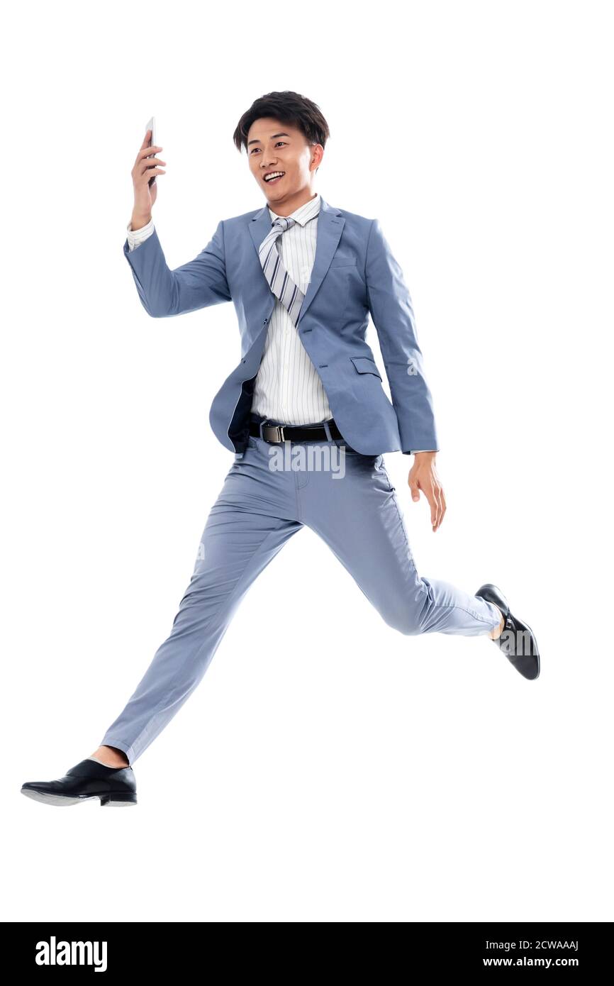Pick up the phone run jump a business man Stock Photo - Alamy