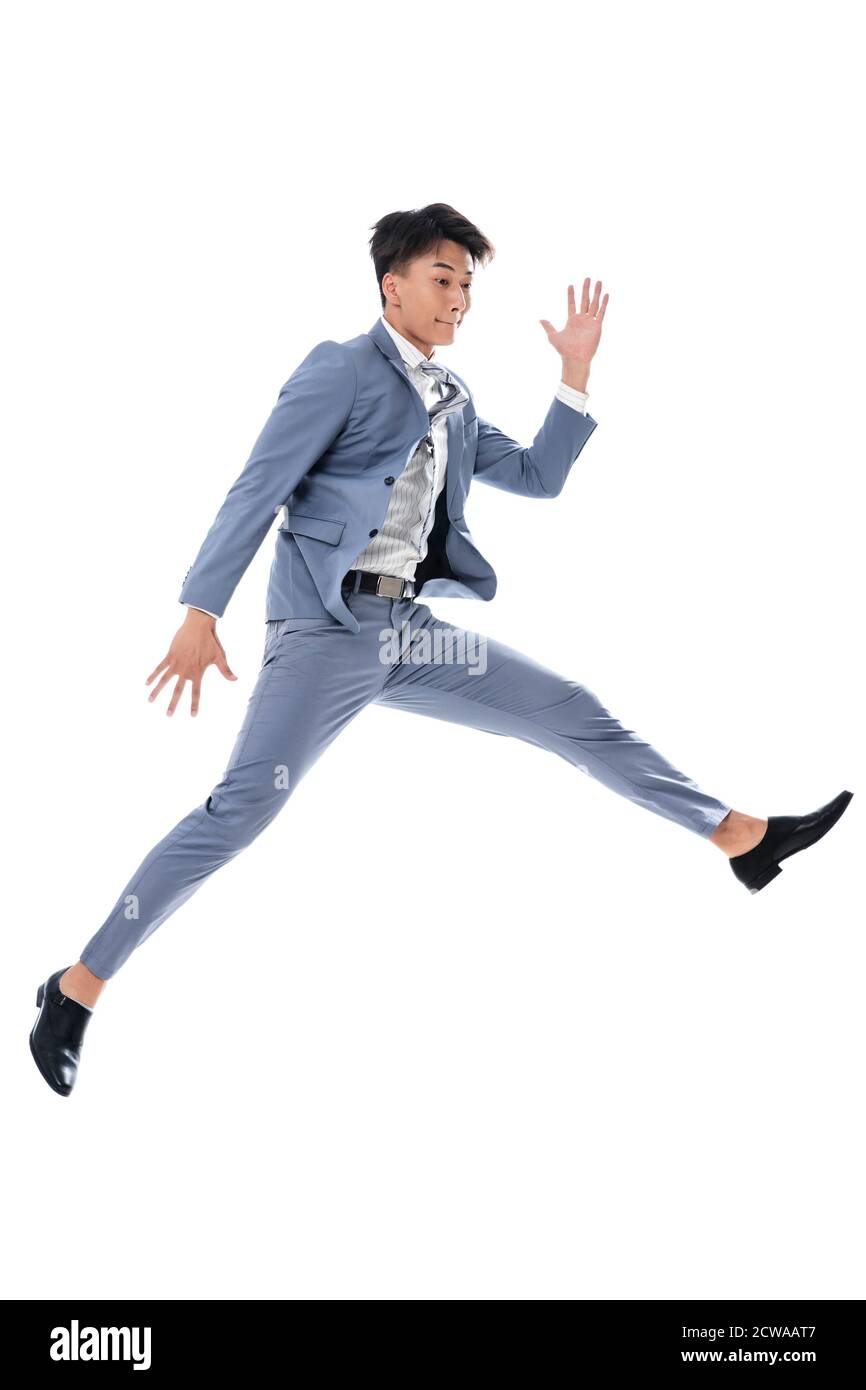Excited jumping business man Stock Photo - Alamy