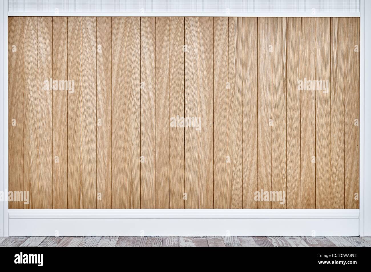 Wooden slats wall in vertical parallel pattern with skirting board and ...