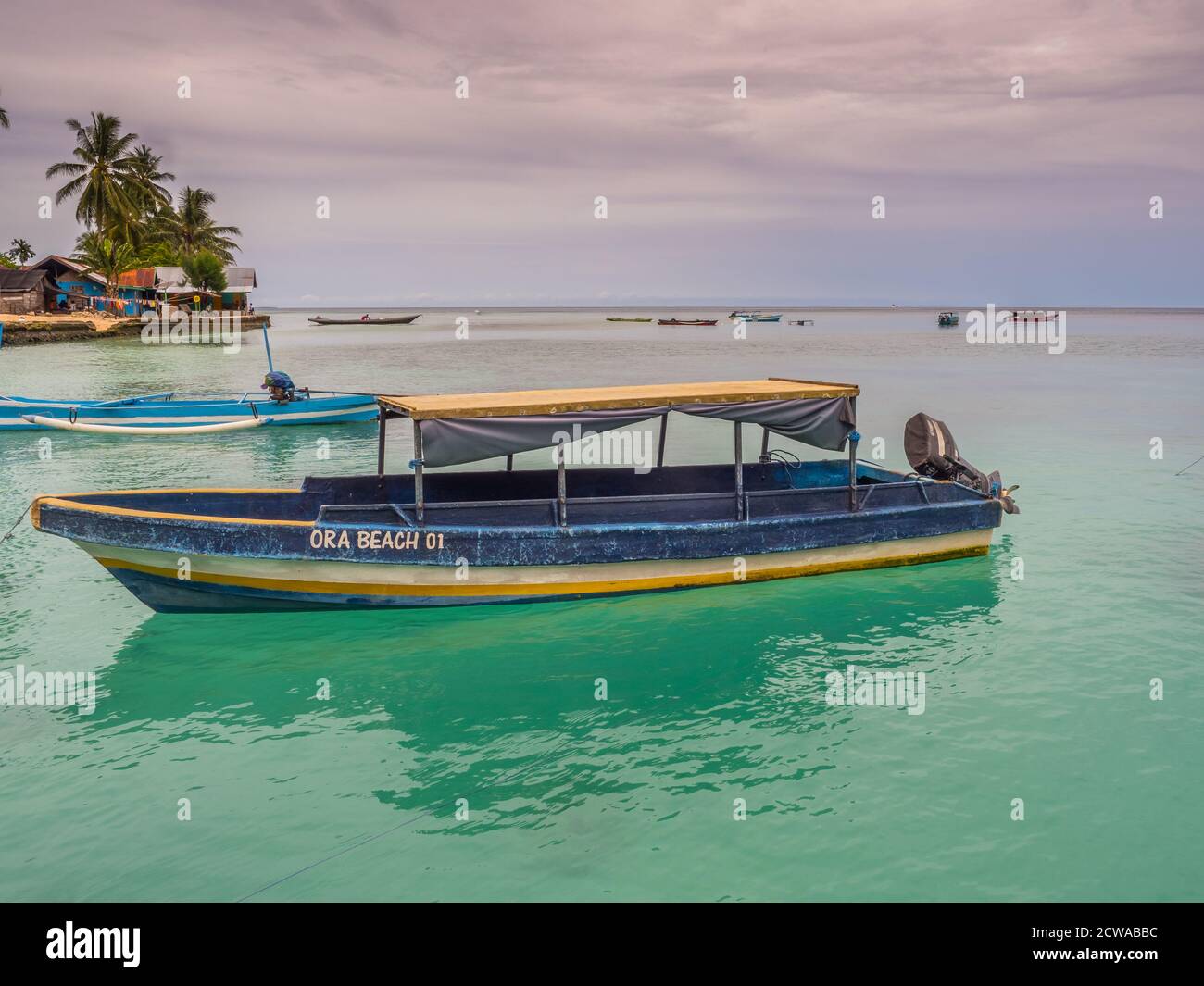 Ora Beach, Indonesia - February 12, 2018: Boats on the tropical beach ...