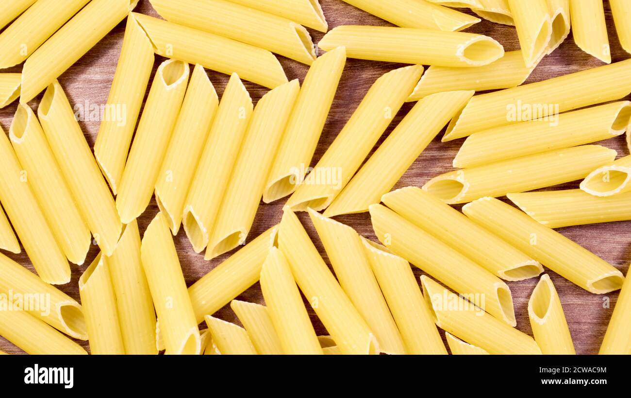 Penne Rigate Raw Pasta is a short pasta with oblique cuts and a ribbed ...