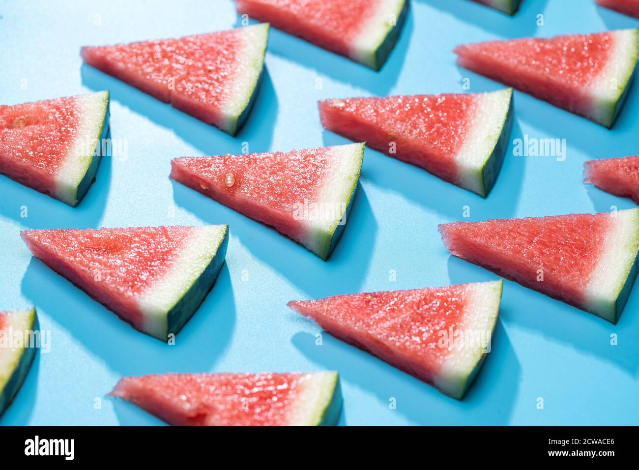 Triangle watermelon slices are arranged Stock Photo - Alamy