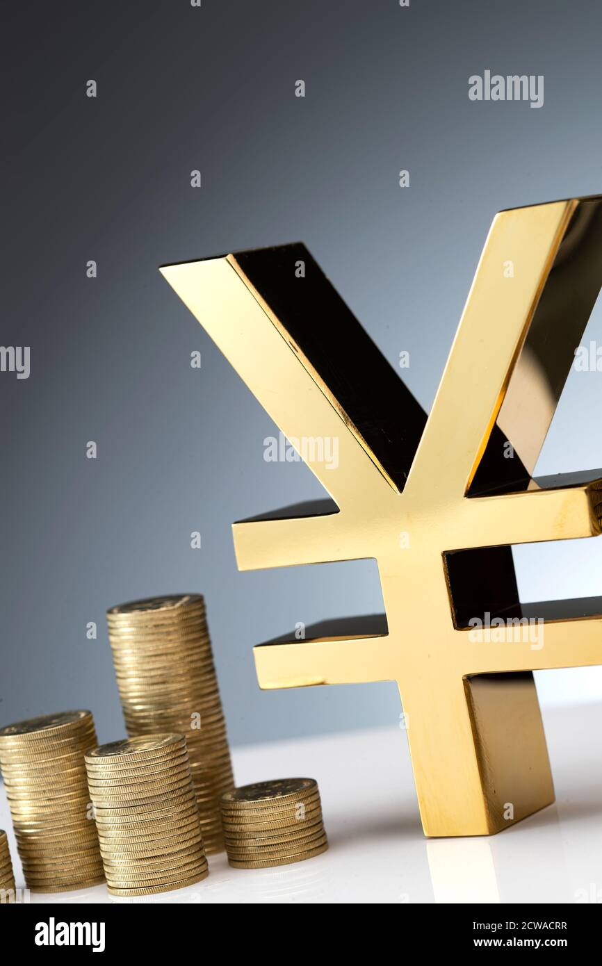 The symbols and gold COINS Stock Photo - Alamy