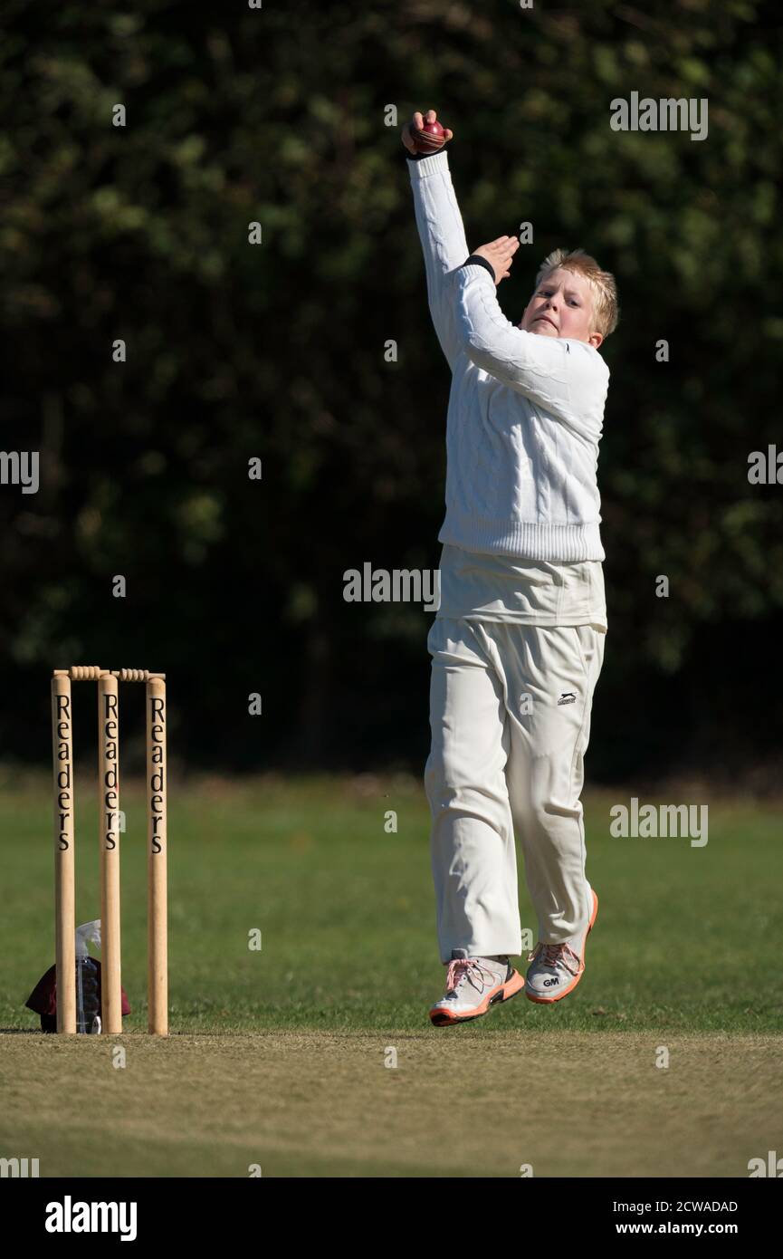 Junior spin bowler in action Stock Photo - Alamy