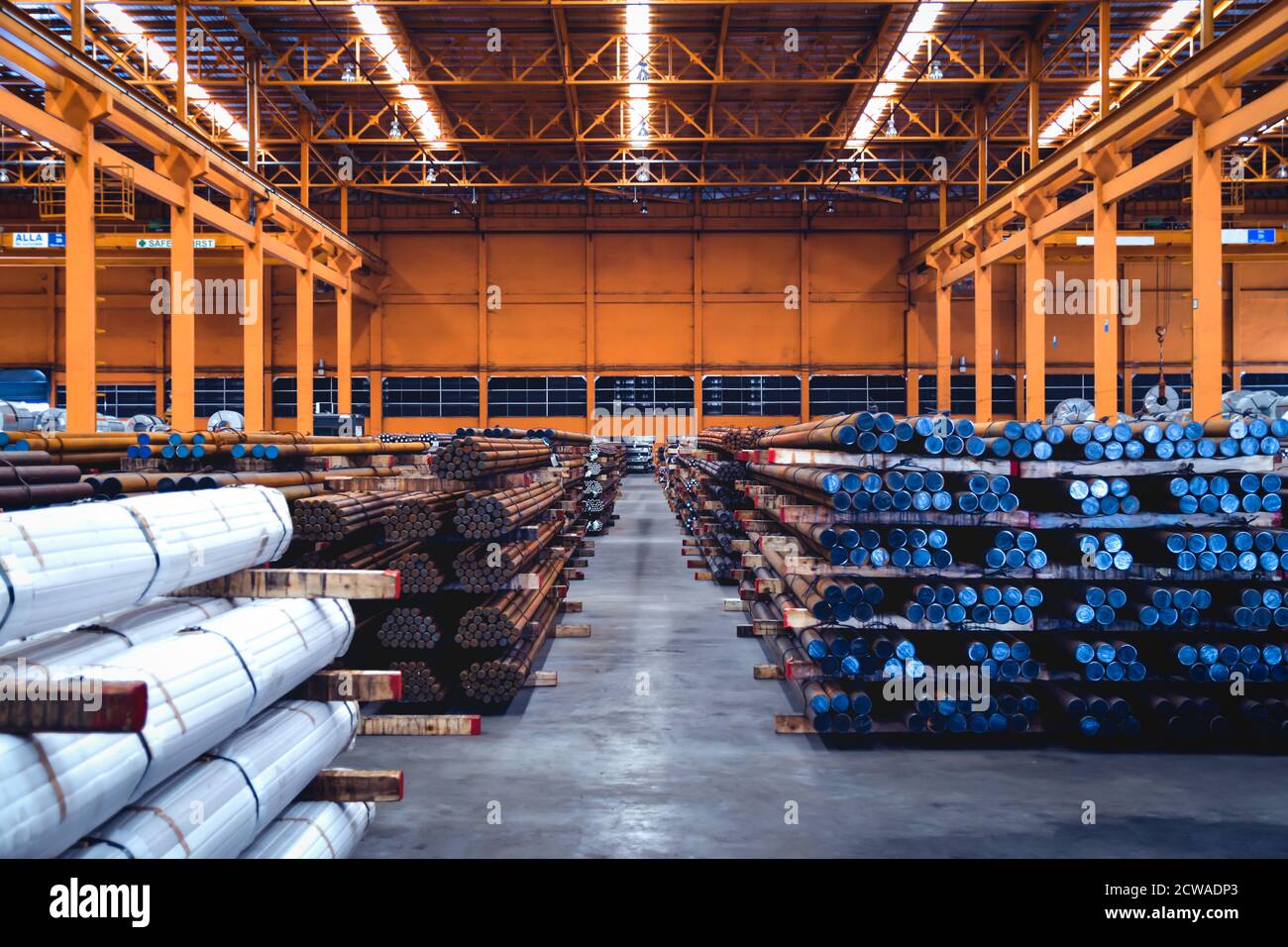 Pack of steel round bar stack in layer inside large distribution ...