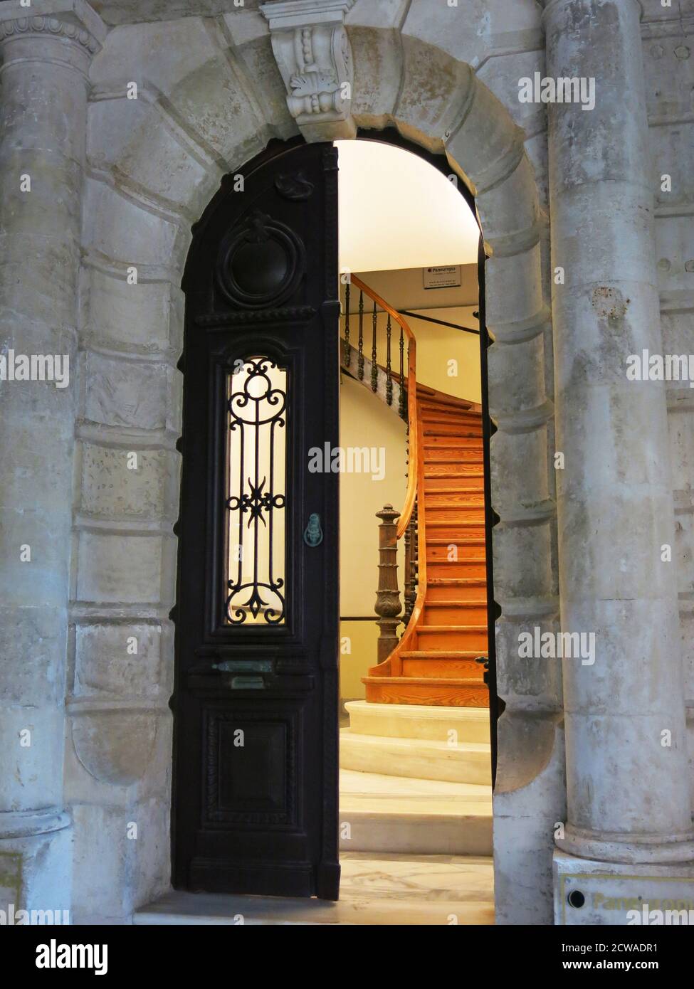 Main entrance of a neoclassical building with a wooden staircase ...