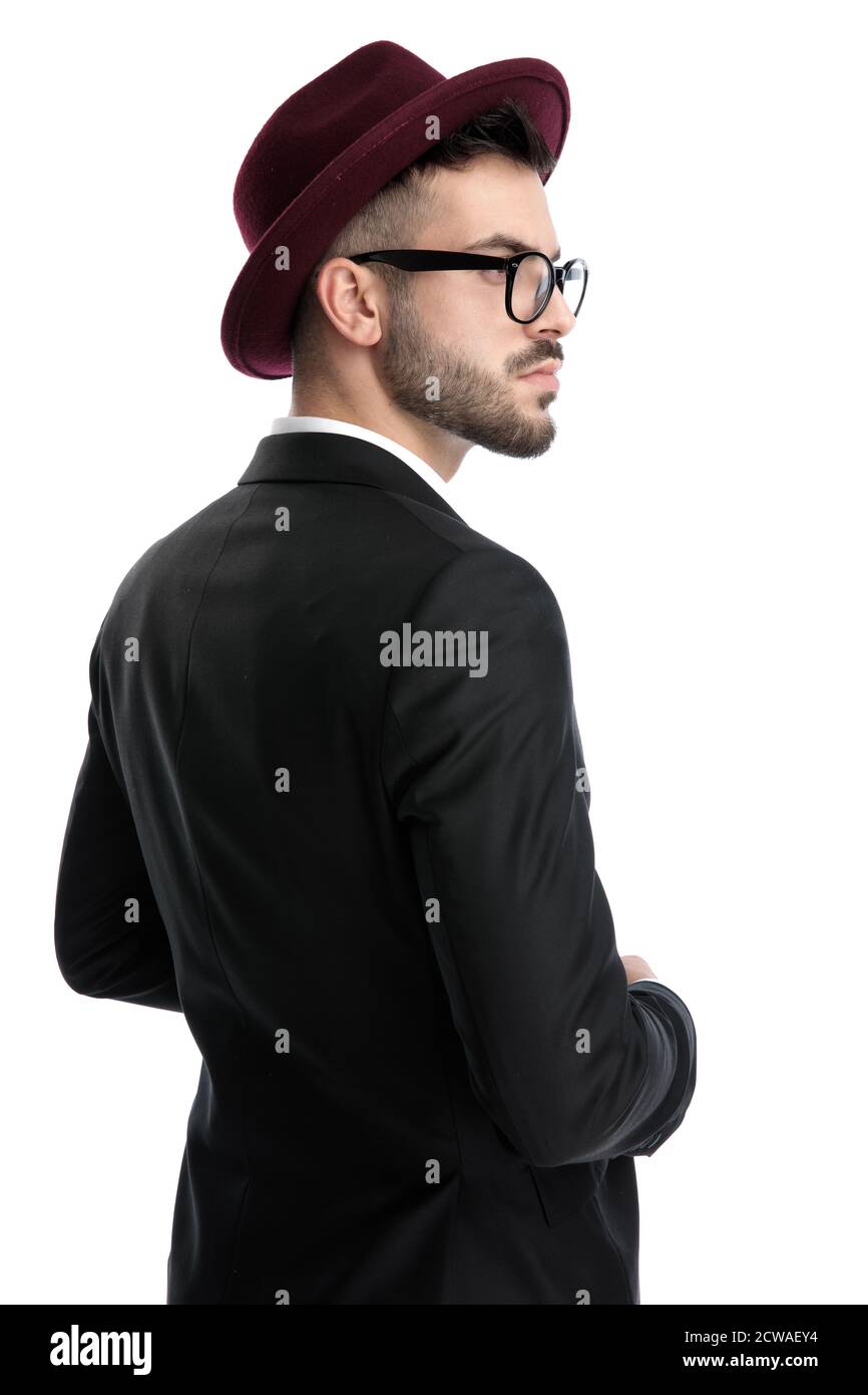 rear view of a beautiful formal business man wearing burgundy hat ...