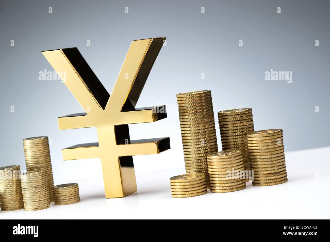 The symbols and base of gold COINS Stock Photo - Alamy
