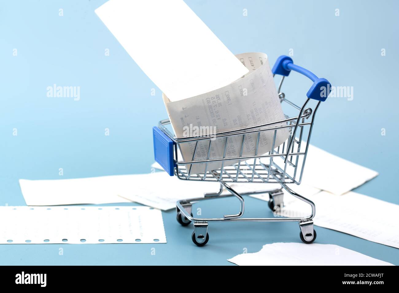 Shopping cart and a lot of bills Stock Photo - Alamy