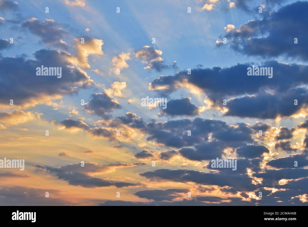 Sun rising behind clouds, Pacsmag, Tolna, Hungary Stock Photo - Alamy