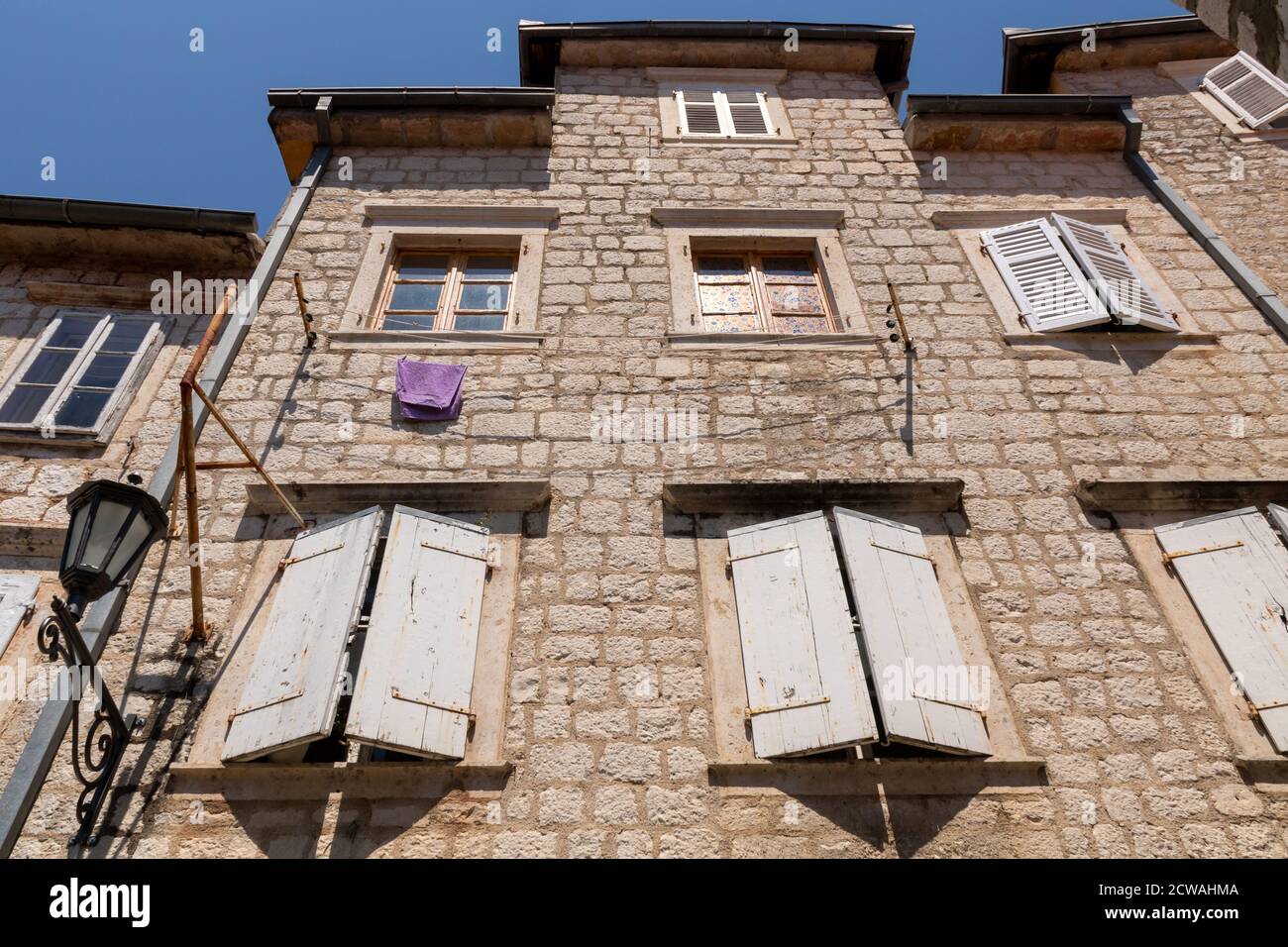 Stone building shuttered windows hi-res stock photography and images ...